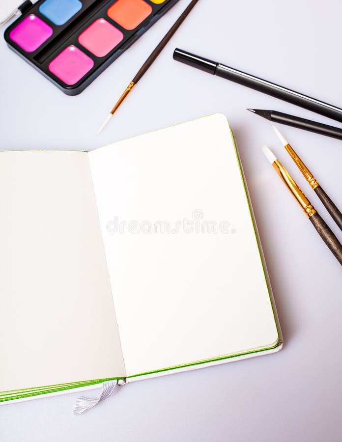 Open Notepad with Blank Pages on Table with Office Tools Stock Photo ...
