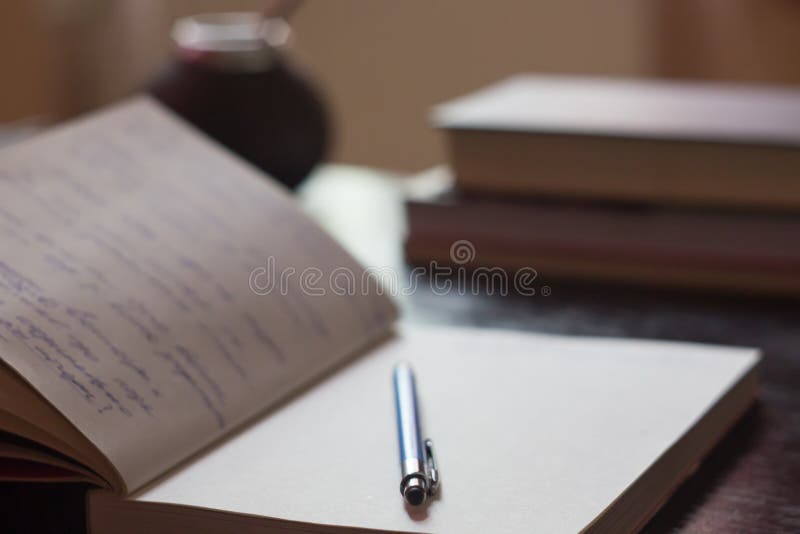 Open Notepad with Handwritten Notes with Blue Pen, Books in the Stock ...