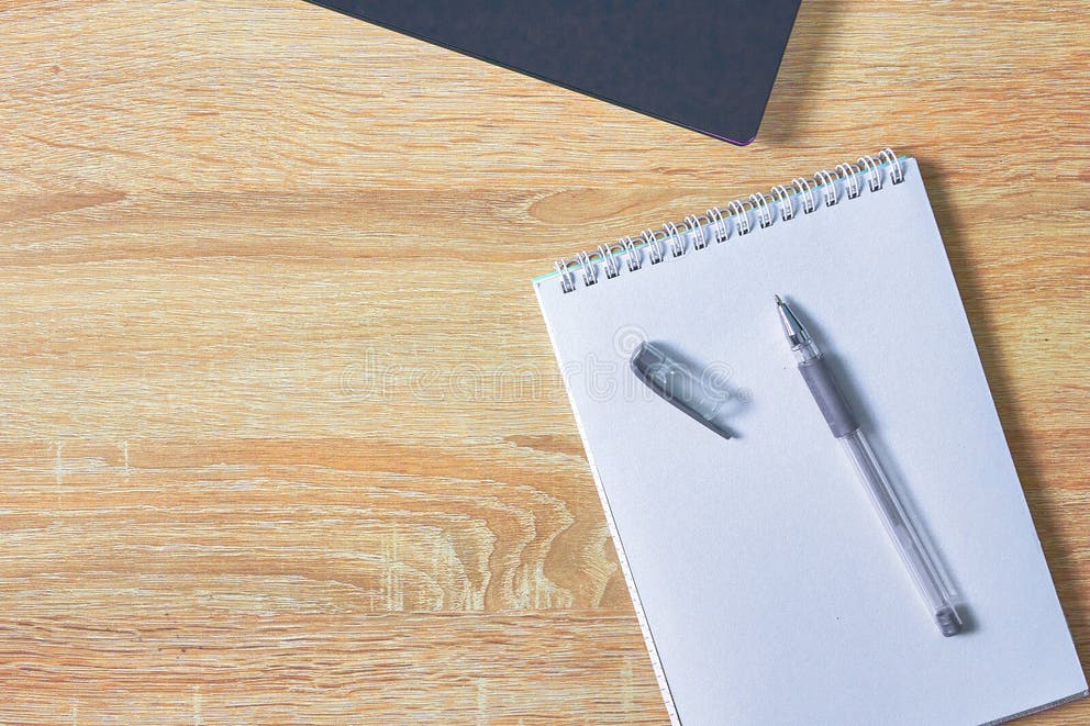 An Open Notepad for Notes a Fountain Pen and a Laptop on a Wooden Table ...