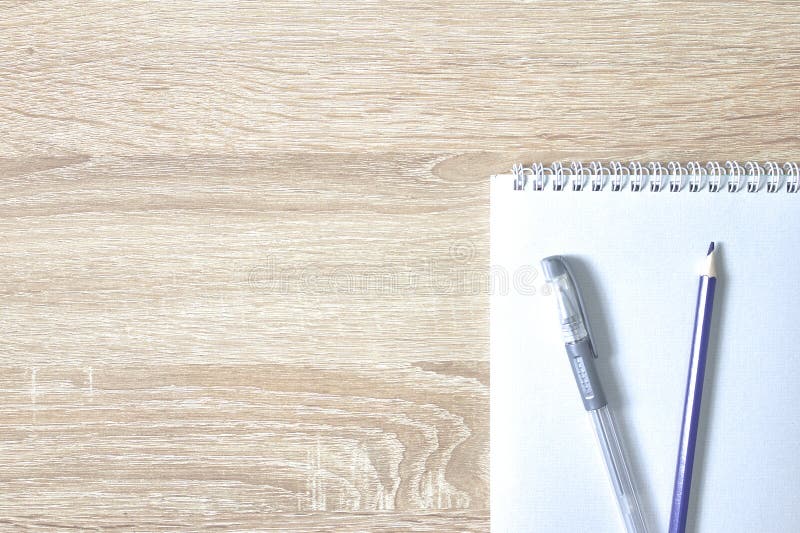 Open Notepad for Notes Pencil and Pen on a Wooden Table with a Copy ...