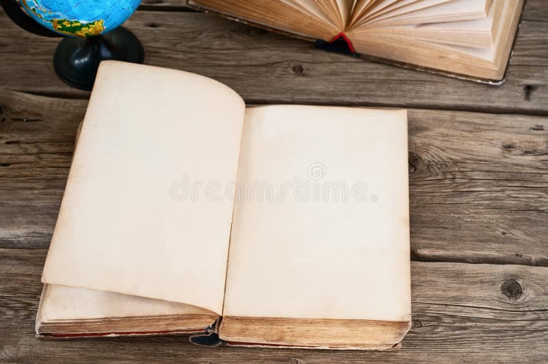 Open Old Book with Blank Pages on Wooden Table with Globe Close Stock ...