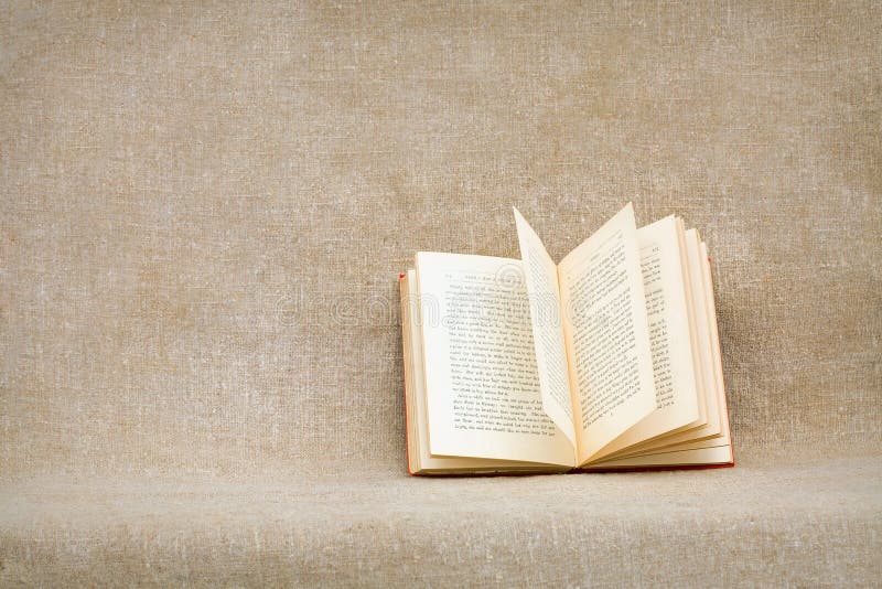 Open Old Book on a Rough Brown Sacking Stock Photo - Image of close ...
