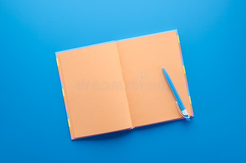Open Orange Notebook with Blue Pens on Blue Background Stock Photo ...