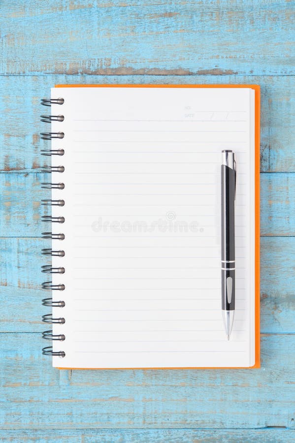 Open Orange Notebook and Pen on Blue Wood Table for Work Stock Photo ...