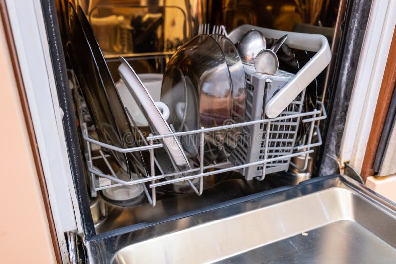 Open Overloaded Dishwasher with Different Dishes and Kitchen Utensils ...