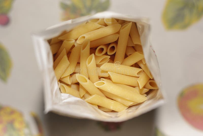 Open Pack of Pasta Seen from Above. Italian Penne Pasta. Stock Photo ...