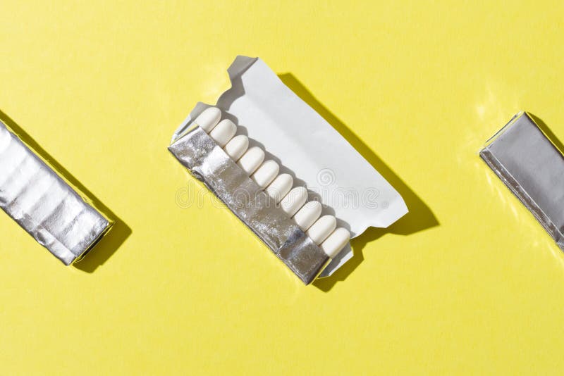 Open Package of Gum on Yellow Background Stock Image - Image of ...