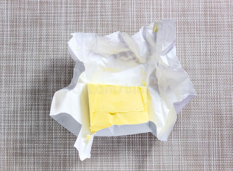 An Open Packet of Leftover Butter on the Table Stock Image - Image of ...