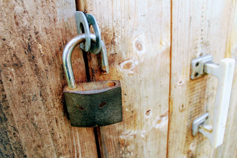 Open a Padlock with Traces of Rust Hanging on the Door Stock Photo ...
