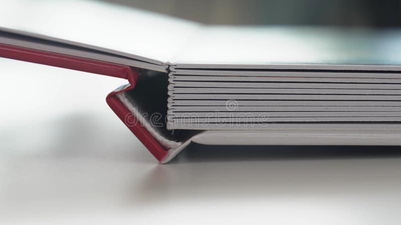 The Open Photobook Binding with Plastic Pages on a White Table. Stock ...