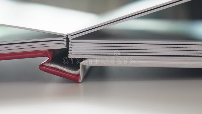 The Open Photobook Binding with Plastic Pages on a White Table. Stock ...