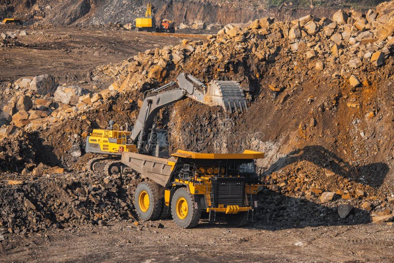Open Pit Mine Industry, Excavator Loading Coal on Big Yellow Mining ...