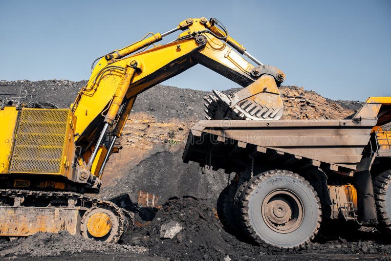 Open Pit Mine Industry, Excavator Loading Coal on Big Yellow Mining ...