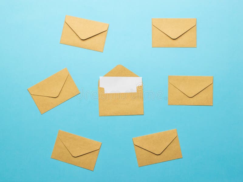 An Open Postal Envelope with a Sheet of White Paper and a Closed ...
