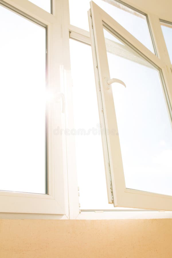 Open Pvc Window Witn Sun Flare at the Background of Multi-storey ...
