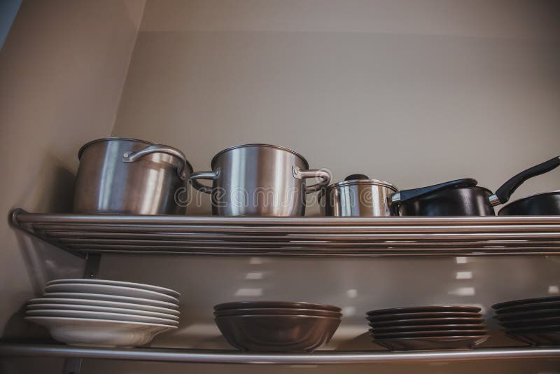 Open Racks with Dishes in the Kitchen Stock Photo - Image of interior ...