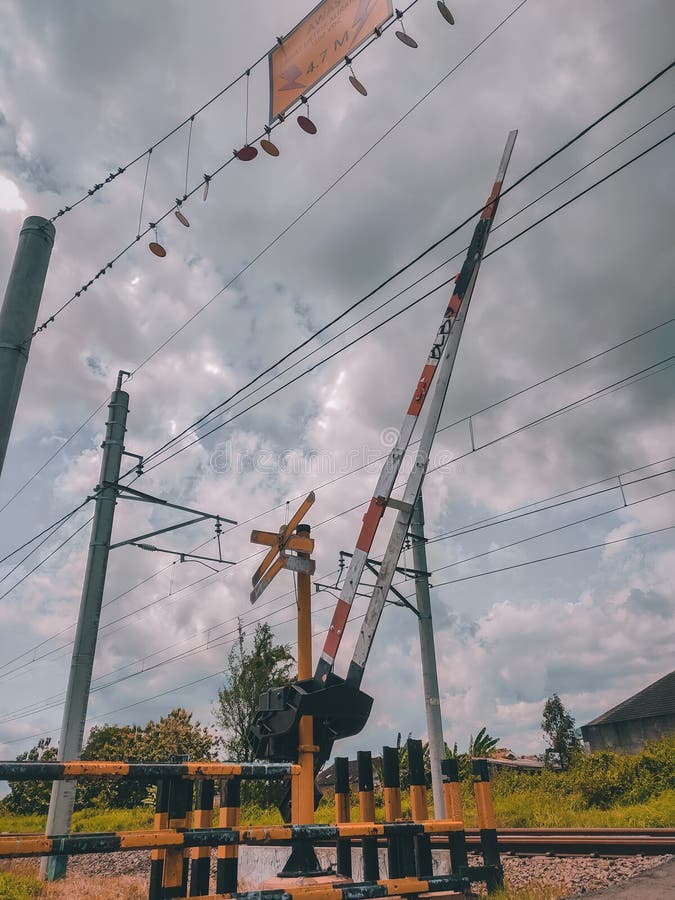 The Open Railroad Crossing and the View of the Cloudy and Beautiful Sky ...