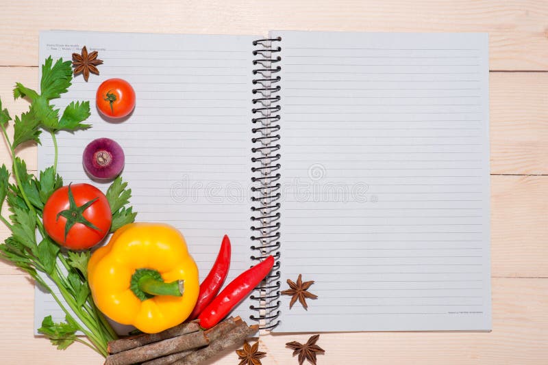Open Recipe Book with Fresh Vegetables on Wooden Table. Stock Photo ...