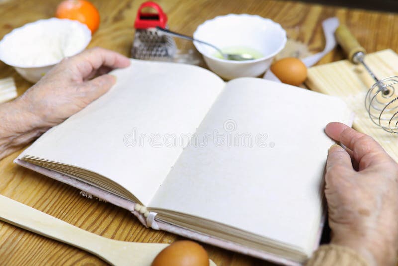 Open Recipe Book in the Hands of an Elderly Woman Stock Image - Image ...