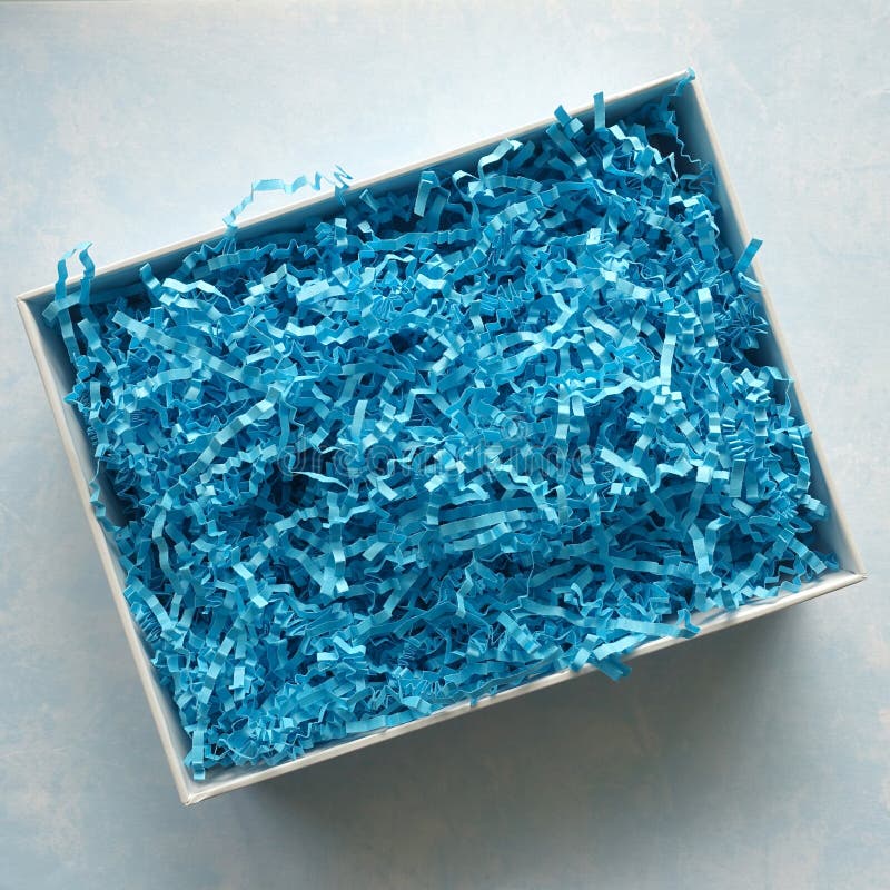 Rectangular White Box with Blue Crinkled Filler Shot from Above Stock ...