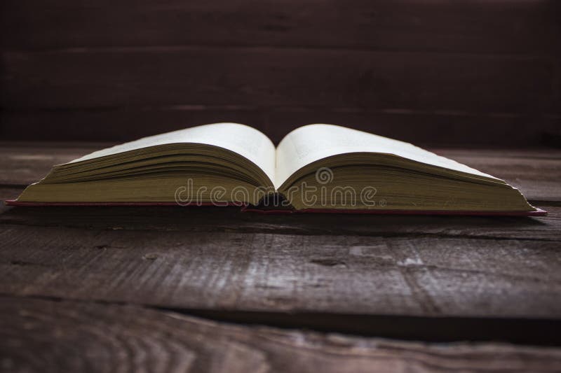 Open Red Book on Old Wooden Table Stock Image - Image of single, rough ...