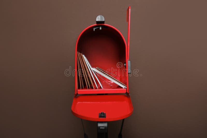 Open Red Letter Box with Envelopes Against Brown Background Stock Image ...