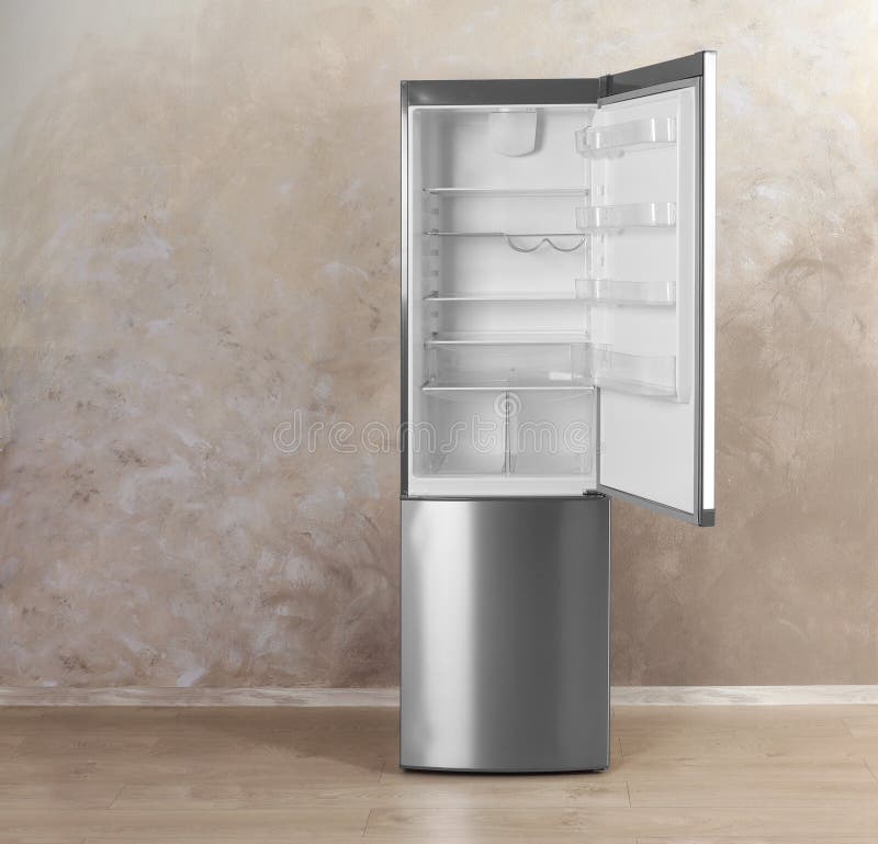 Open Refrigerator with Empty Shelves Near Grey Wall Indoors Stock Image ...