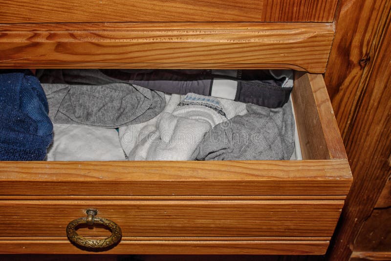 Open Retractable Drawer of an Old Wooden Cabinet with Clothes Stock ...