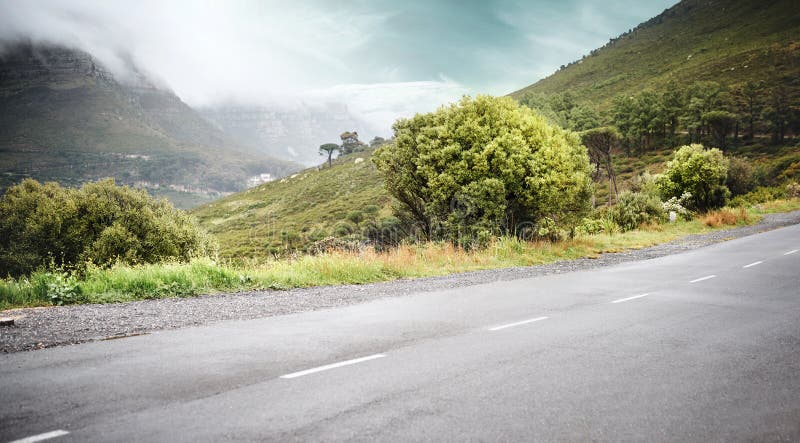 The Open Road. Still Life Shot of an Empty Road Alongside a Mountain ...