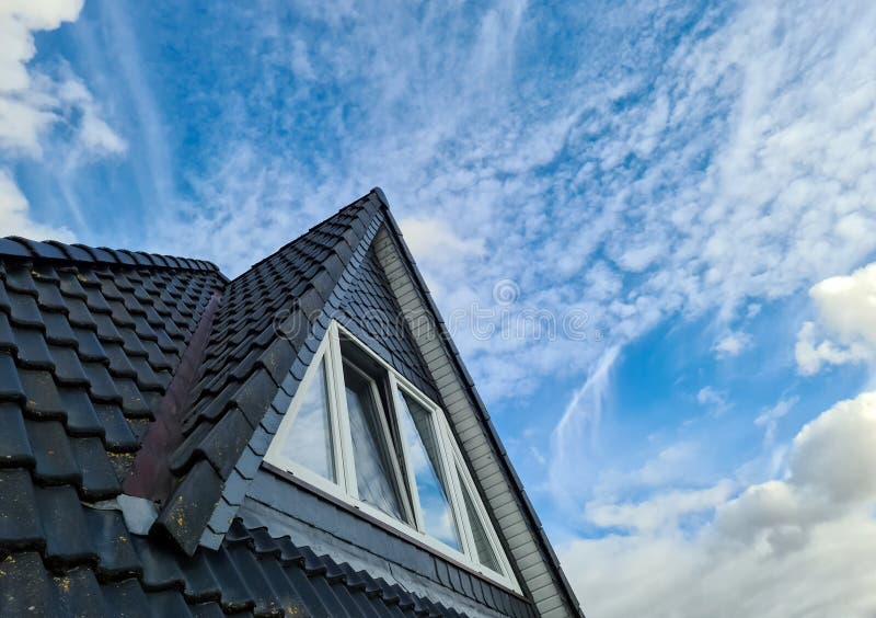 Open Roof Window in Velux Style with Black Roof Tiles Stock Photo ...