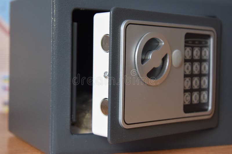 An Open Safe Door with a Combination Lock for Safe Storage of Money ...