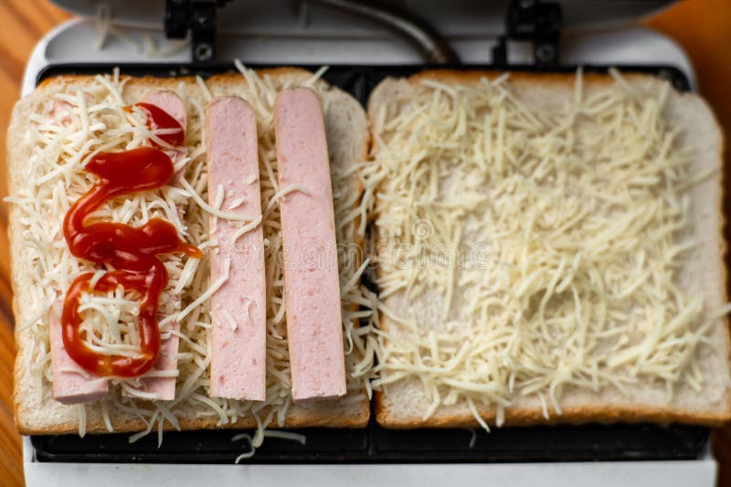 Open Sandwich Maker with Cheese Toast and Sausages. Sandwiching Stock ...