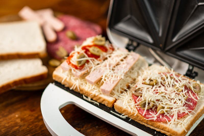 Open Sandwich Maker with Cheese Toast and Sausages. Sandwiching Stock ...