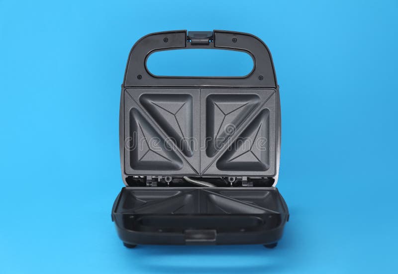 Open Sandwich Maker on Light Blue Background Stock Photo - Image of ...