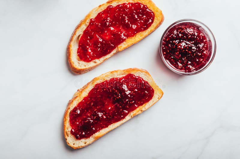 Raspberry jam on toast stock photo. Image of gastronomy - 268209836