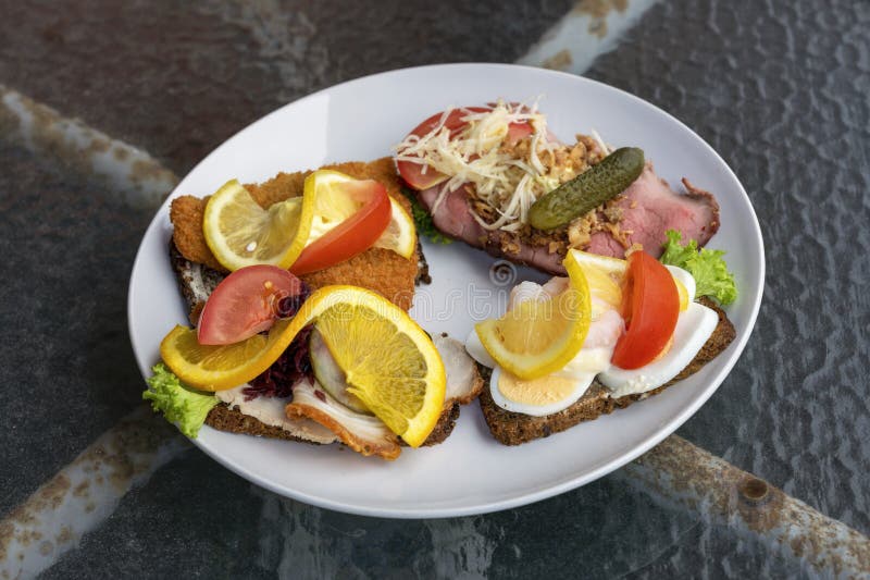 Open Sandwiches Bread with Different Kind of Cold Cuts on a Plate ...