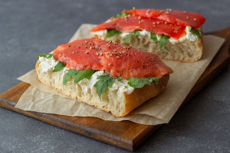 Open Sandwiches with Salmon, Arugula and White Cheese. Healthy Eating ...