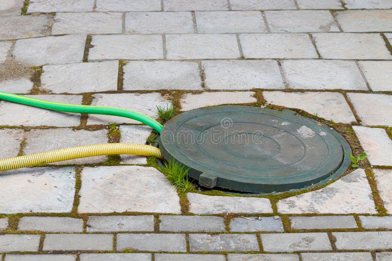 Open Sewer Manhole on a City Street Stock Image - Image of cleaning ...