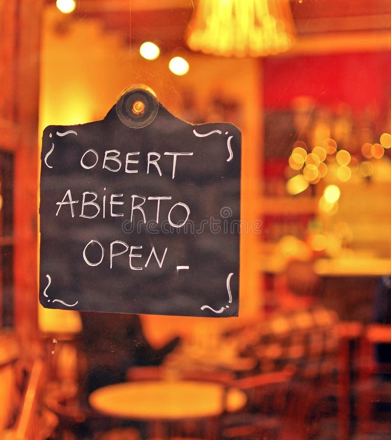 Open Sign in English, Catalan and Spanish Stock Photo - Image of cafe ...