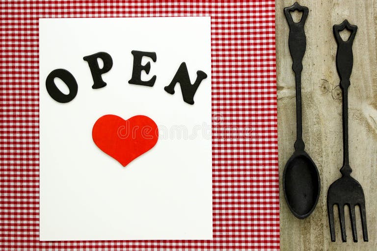 Open Sign with Red Checkered Tablecloth and Cast Iron Spoon and Fork ...