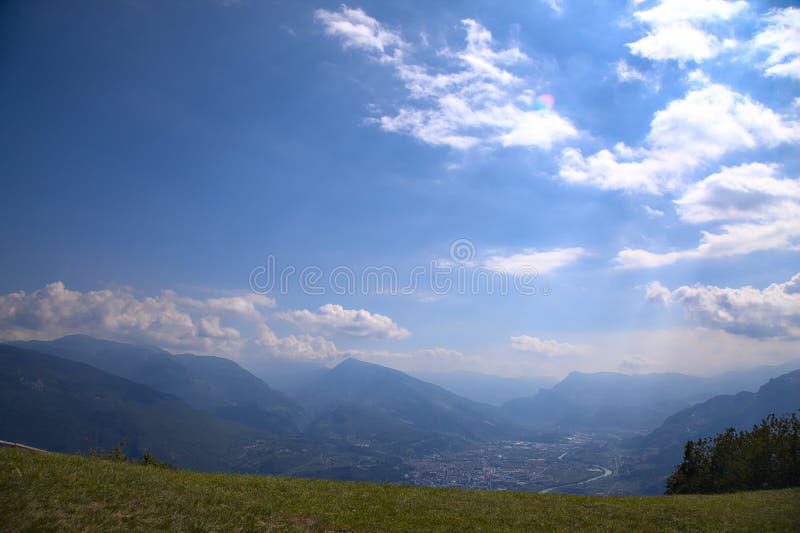 Open Space in the Mountains with Mountain Range and a Town in the ...