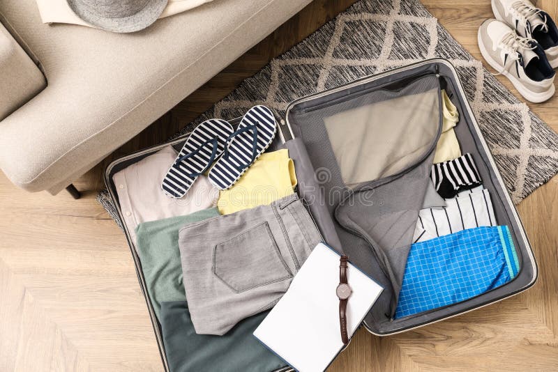 Open Suitcase with Different Men Clothes and Accessories on Floor, Top ...