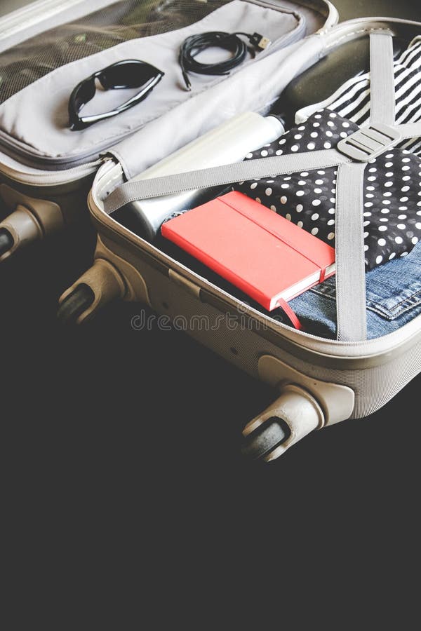 Open Suitcase Full of Clothes Isolated on Black Background Stock Image ...