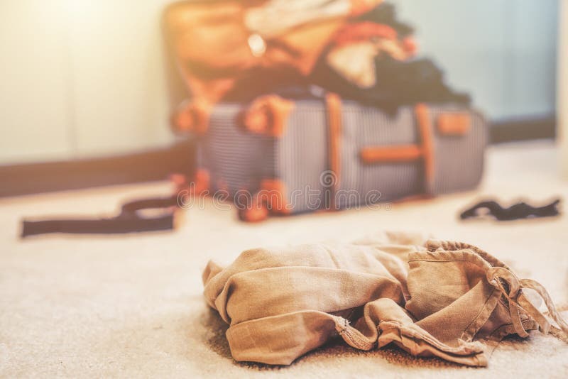 Open Suitcase Full of Clothes in Room. Stock Photo - Image of home ...