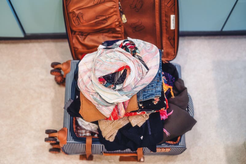 Open Suitcase Full of Clothes in Room. Stock Photo - Image of journey ...