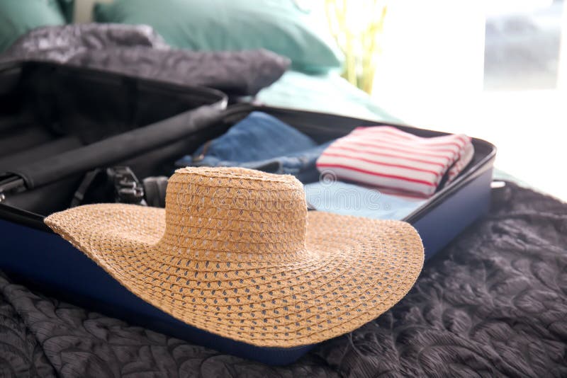 Open Suitcase with Packed Things on Bed Stock Photo - Image of closeup ...