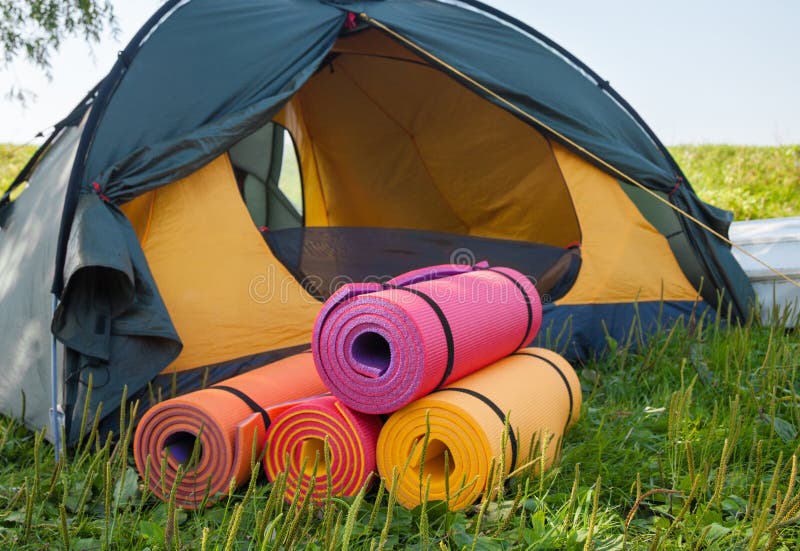Open Tent and Rolled Sleeping Pads Stock Photo - Image of halt ...