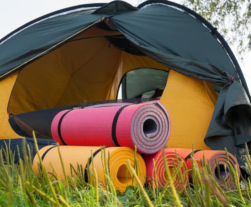 Open Tent and Rolled Sleeping Pads Stock Image - Image of shelter ...