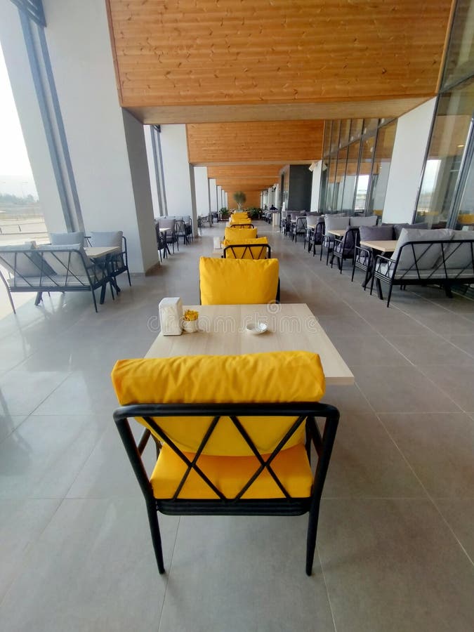 Open Terrace with Rows of Tables and Chairs Stock Photo - Image of ...