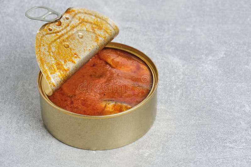 Open Tin Can with Fish in Tomato on Gray Concrete Background. Stock ...